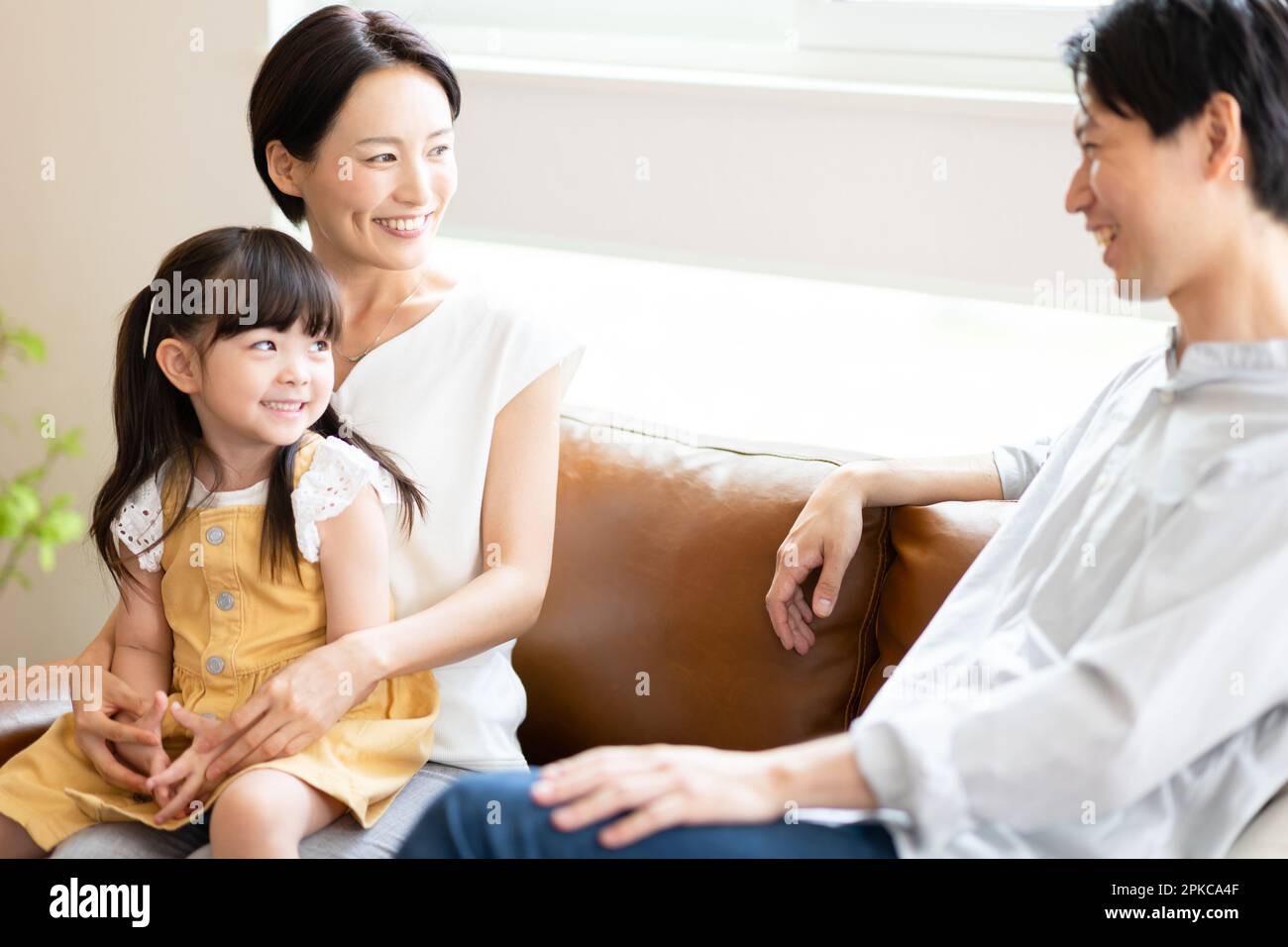 A family at home Stock Photo - Alamy