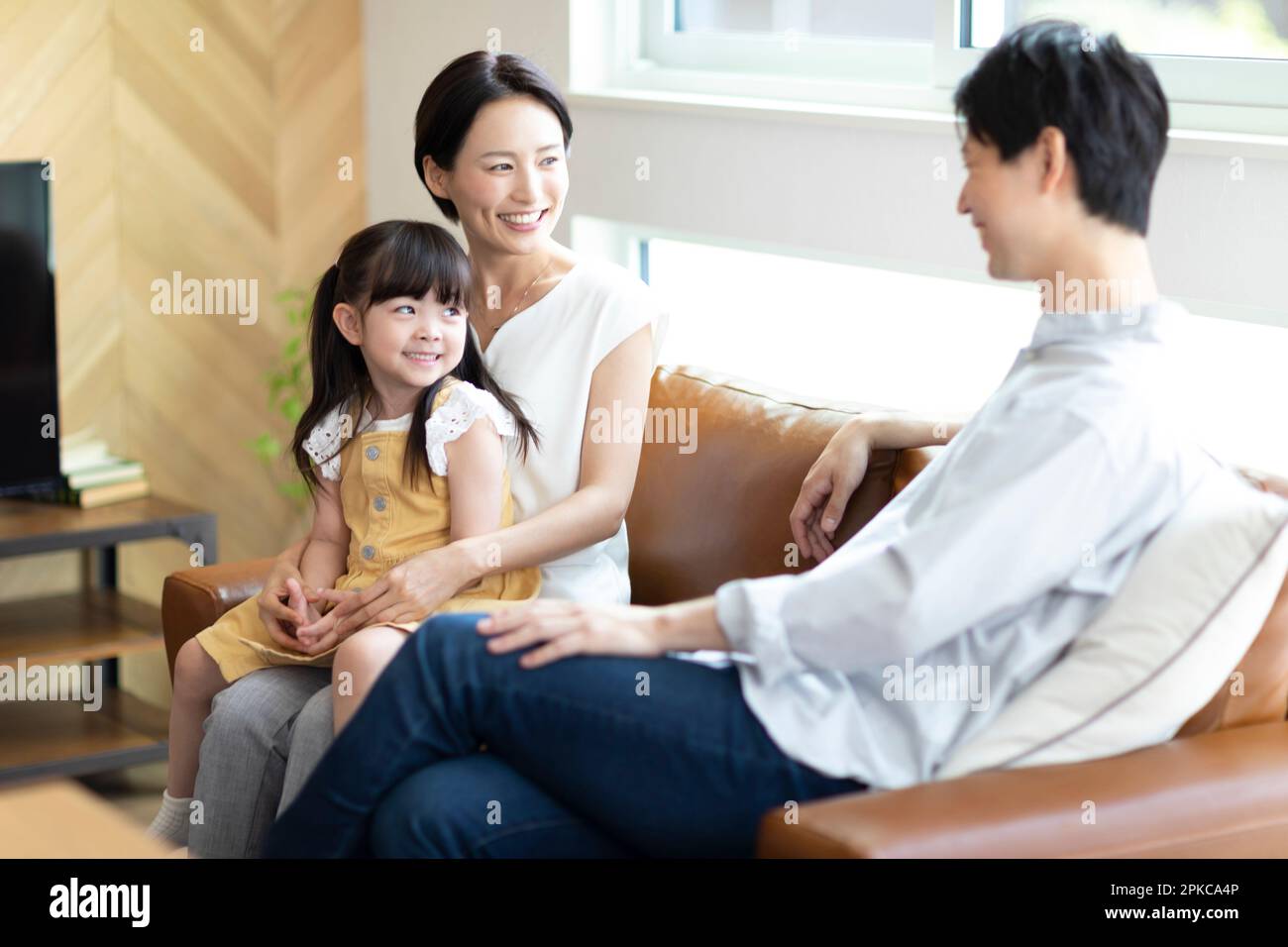 A family at home Stock Photo - Alamy