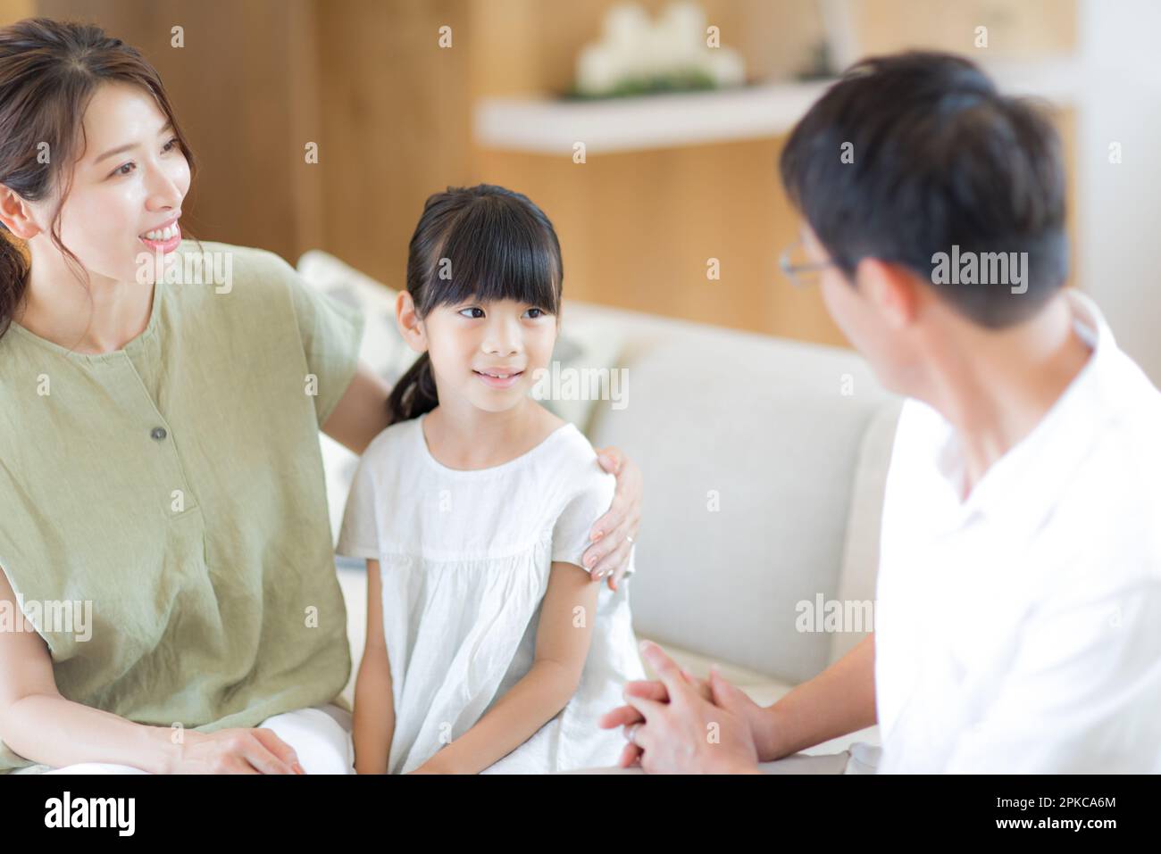 Parent and Child Talking on Sofa Stock Photo - Alamy