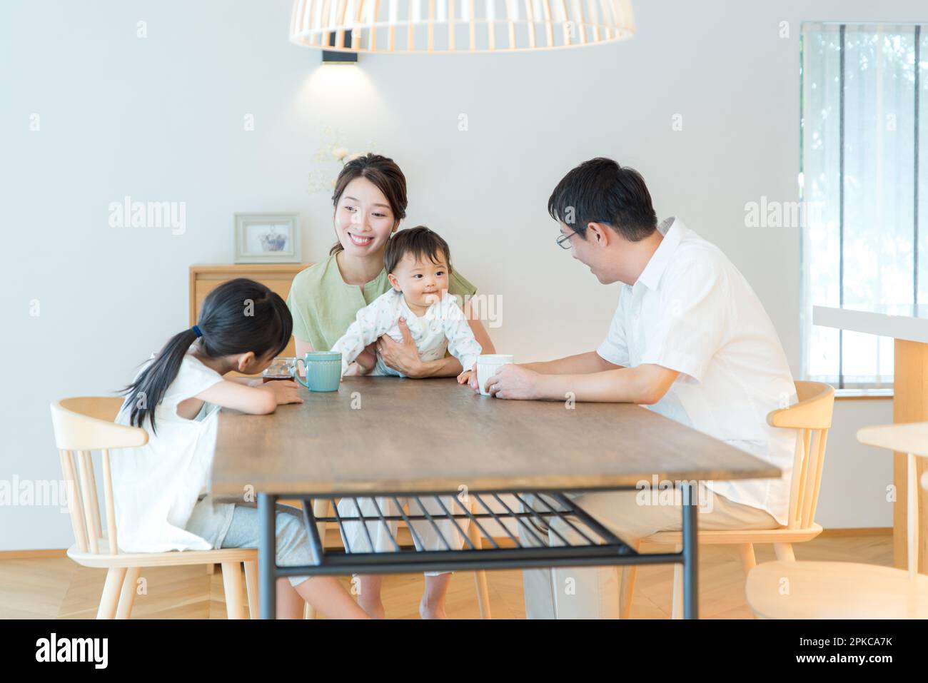 Family talking in the dining room Stock Photo - Alamy
