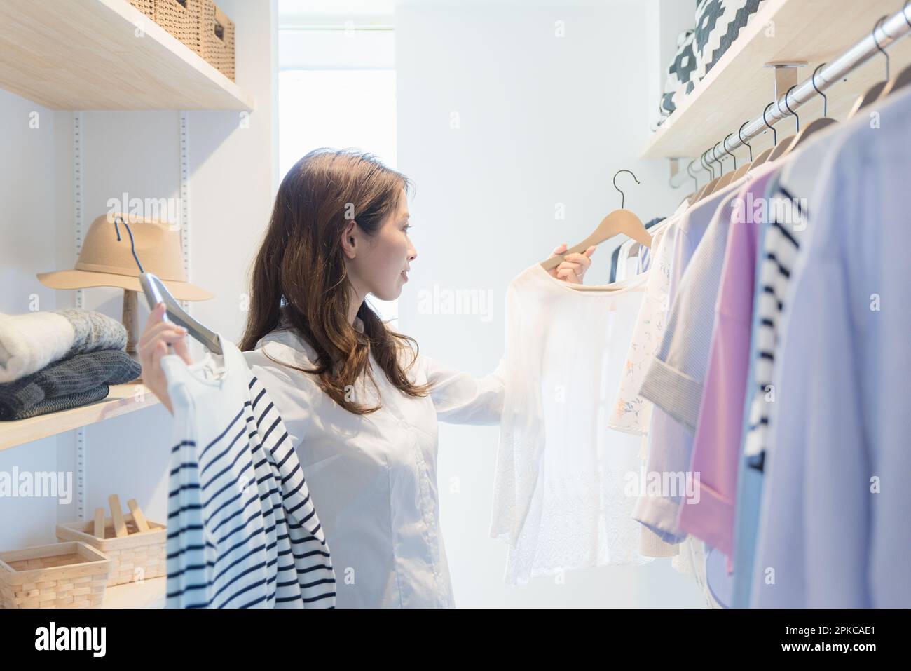 Choosing clothes adult home hi-res stock photography and images - Alamy