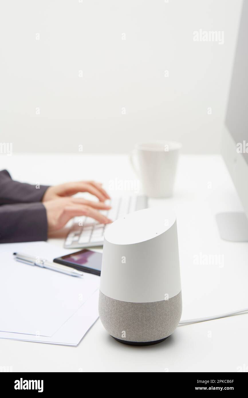 AI speaker on a white work desk Stock Photo - Alamy