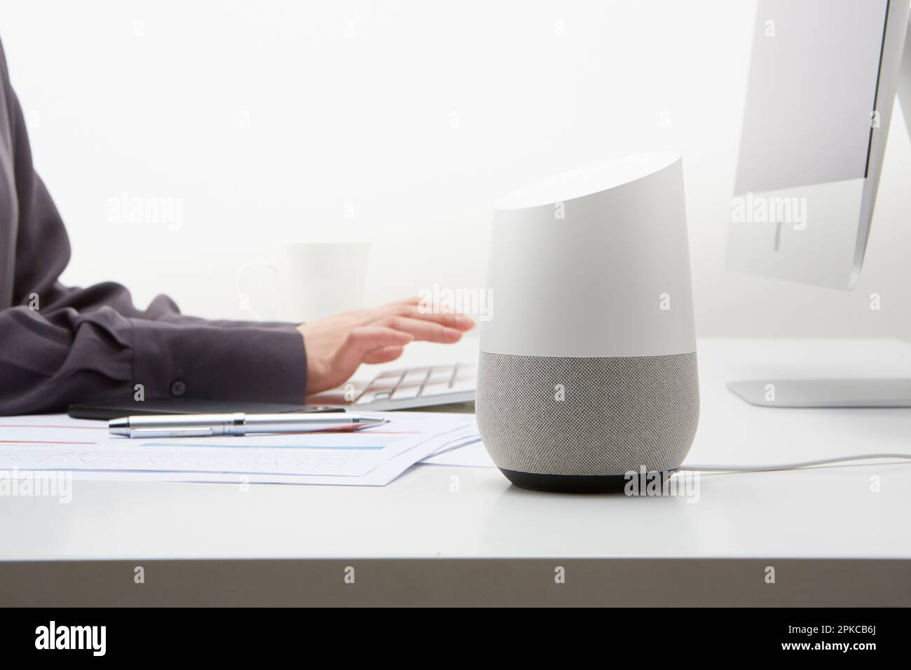 AI speaker placed on white work desk Stock Photo - Alamy