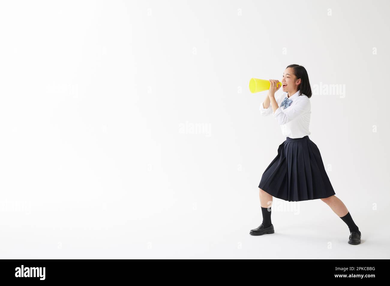 High school girl shouting with megaphone Stock Photo - Alamy