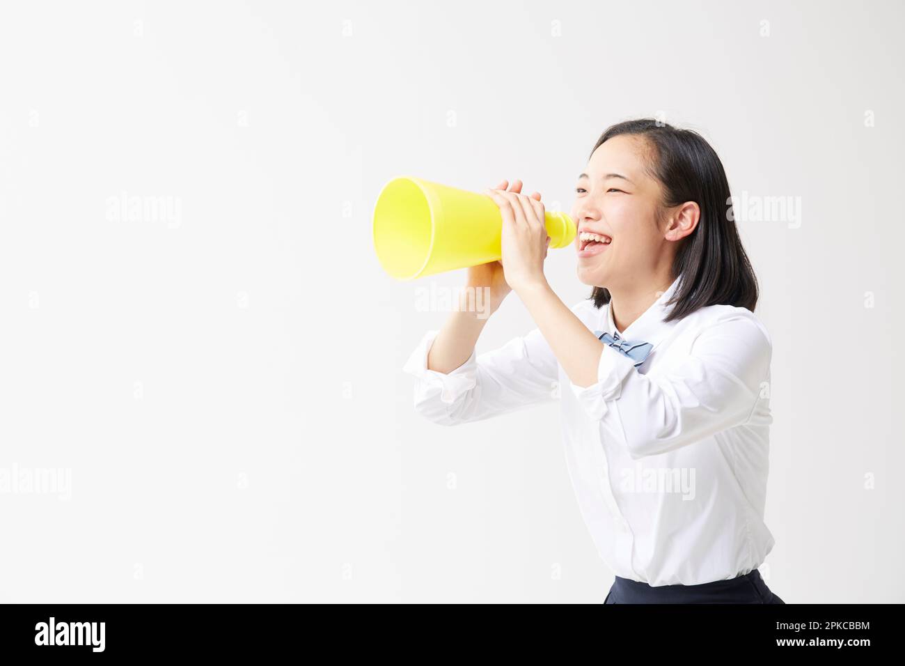 High school girl shouting with megaphone Stock Photo - Alamy