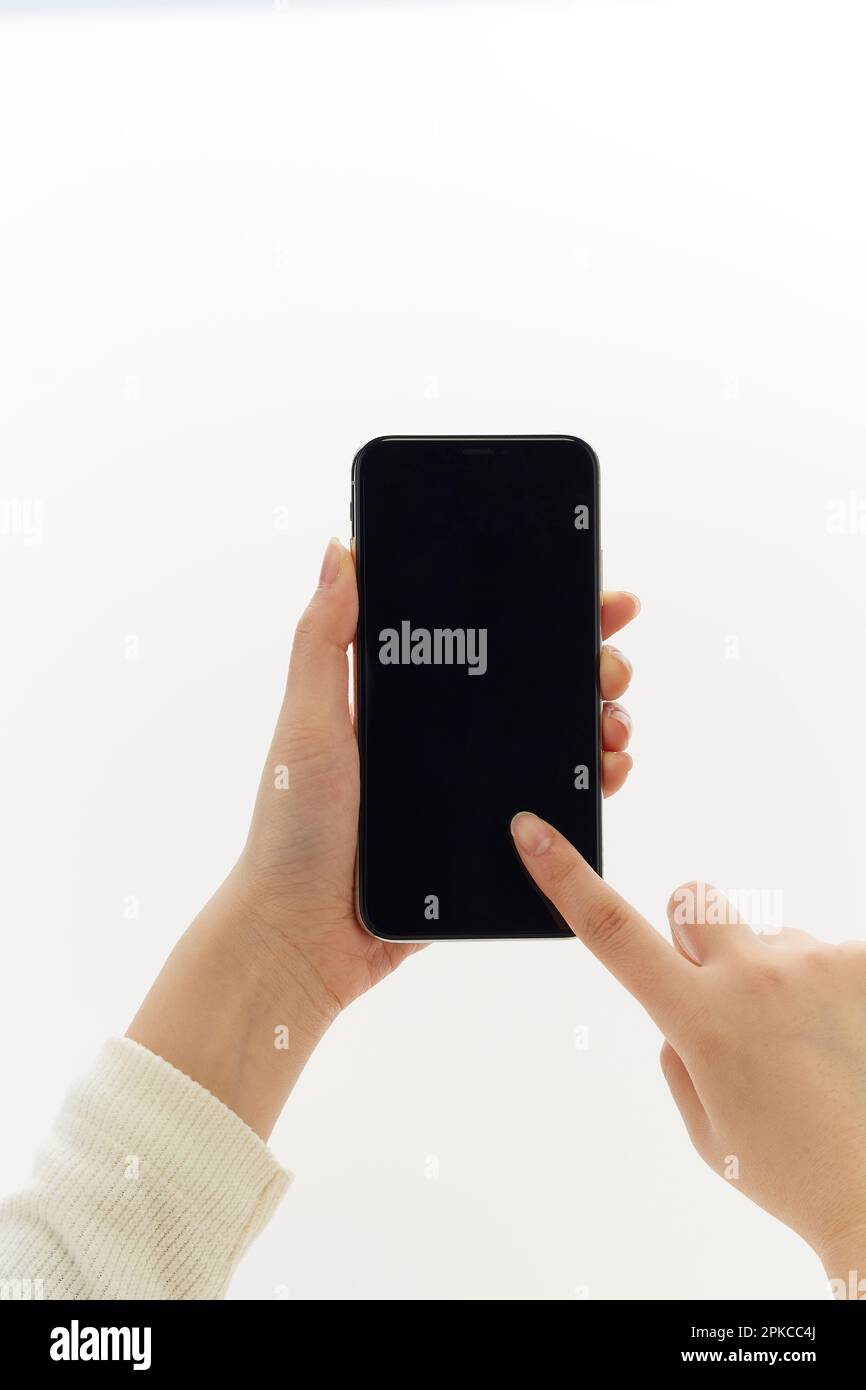 A person operating a new smartphone Stock Photo - Alamy