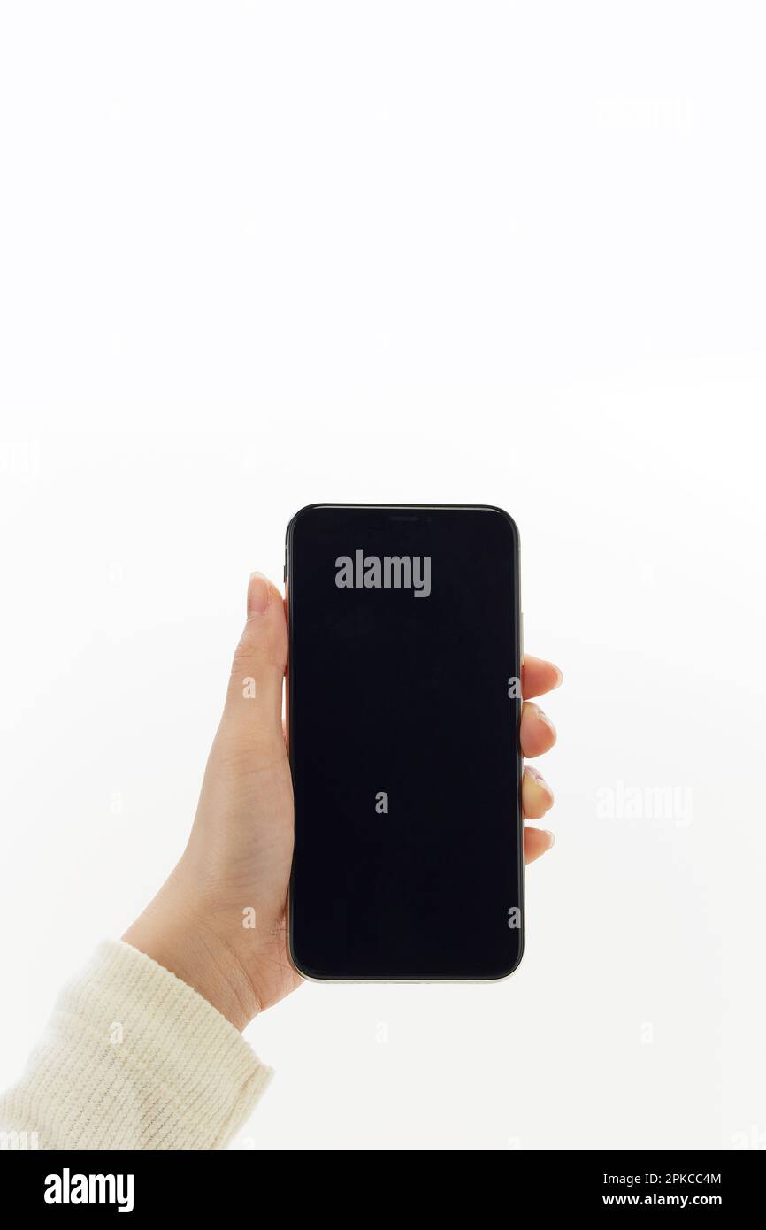 Two hands holding a new smartphone in portrait orientation Stock Photo ...