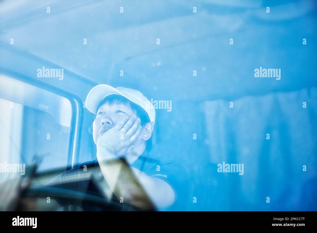 Truck driver wearing cap hi-res stock photography and images - Alamy