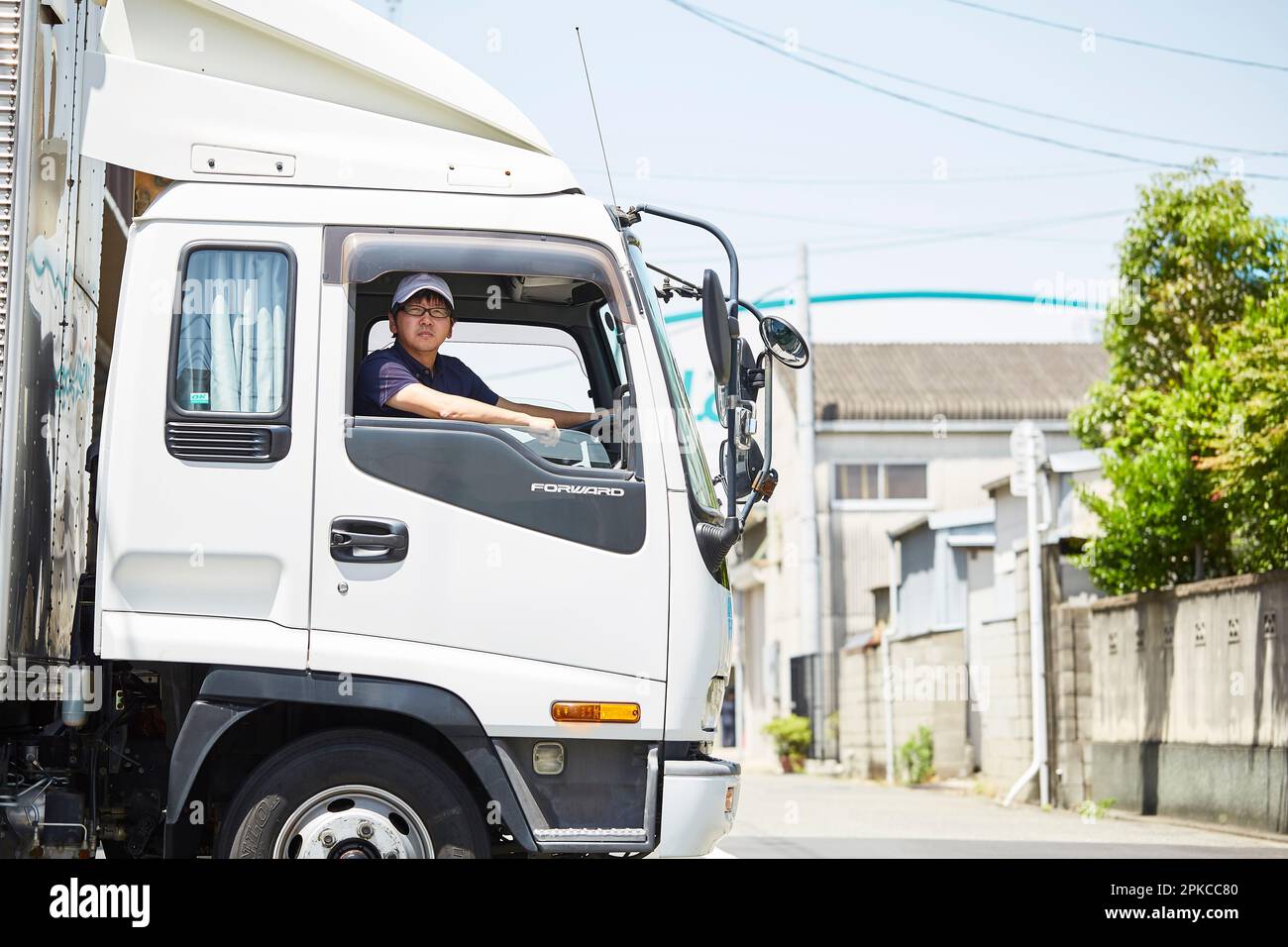 Man driving a big truck Stock Photo - Alamy