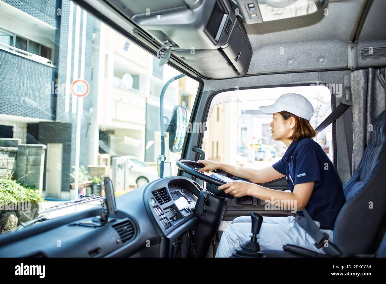 Working woman driving a big truck Stock Photo - Alamy