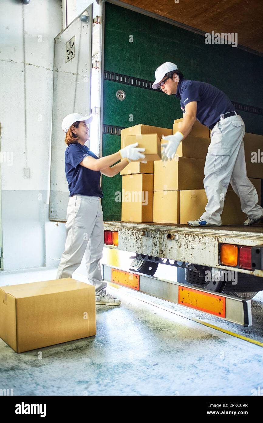 Woman in warehouse cardboard boxes hi-res stock photography and images ...