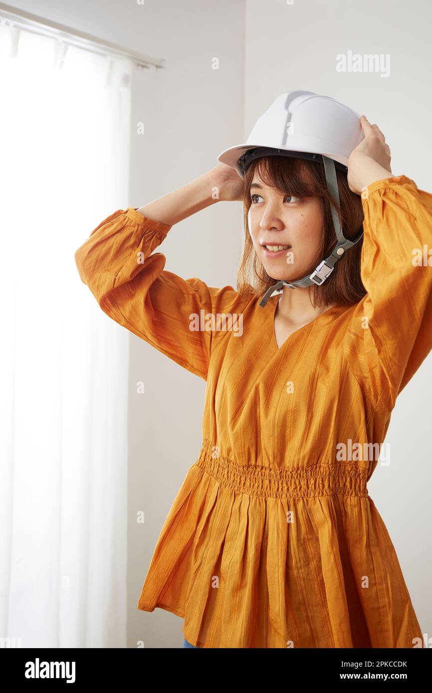 Woman with a helmet Stock Photo - Alamy