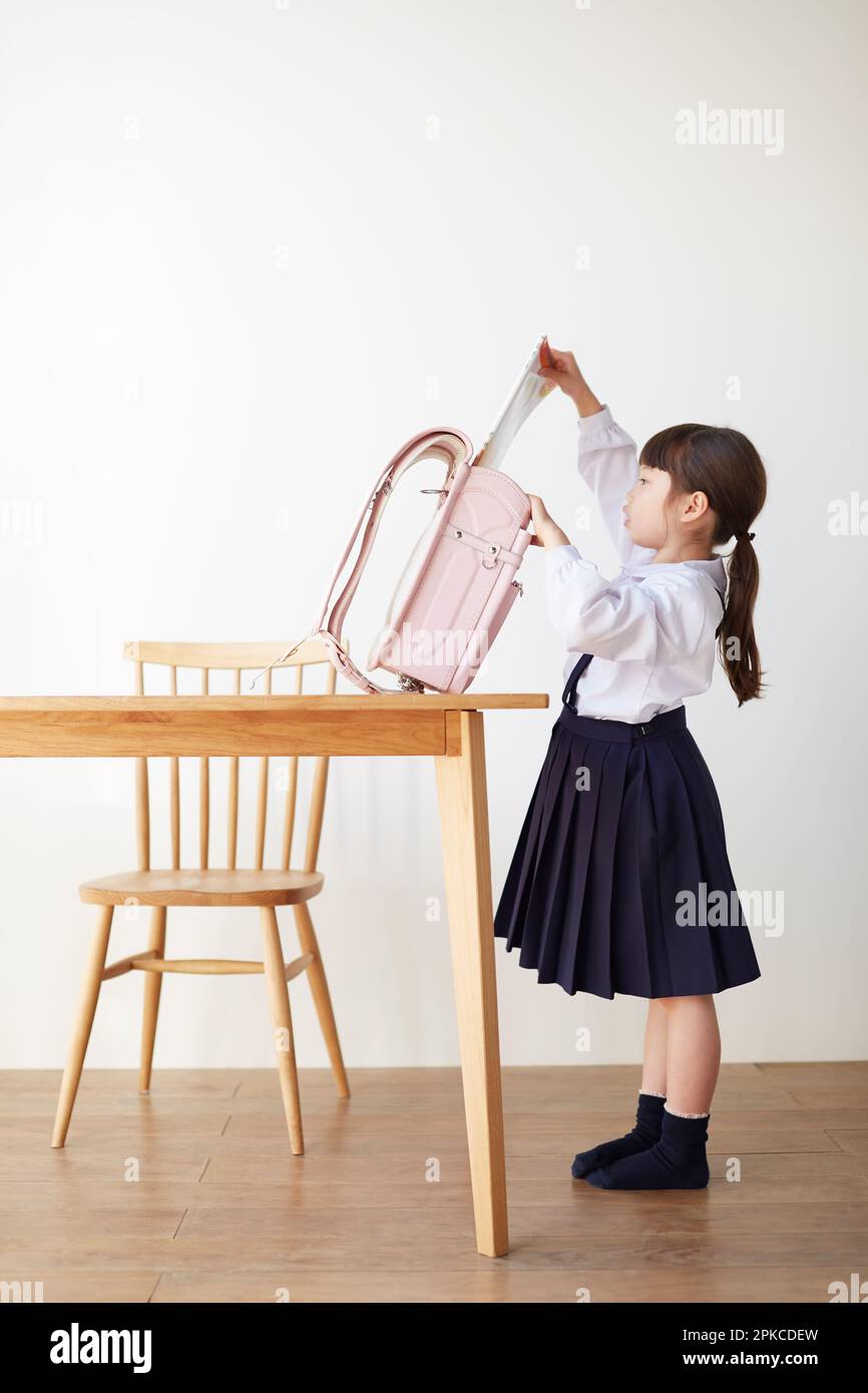 Putting on uniform for school hi-res stock photography and images - Alamy