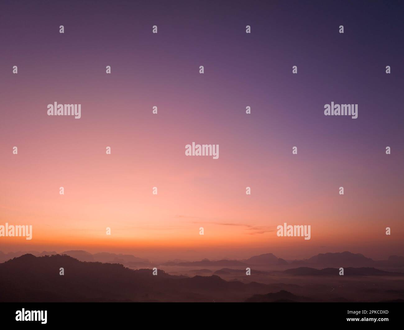 aerial view amazing colors in the sky at dawn over the misty sea in the ...