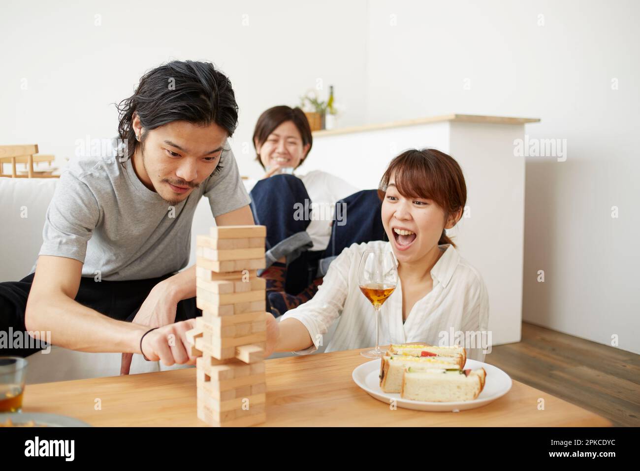 Men and women playing a balancing game Stock Photo - Alamy