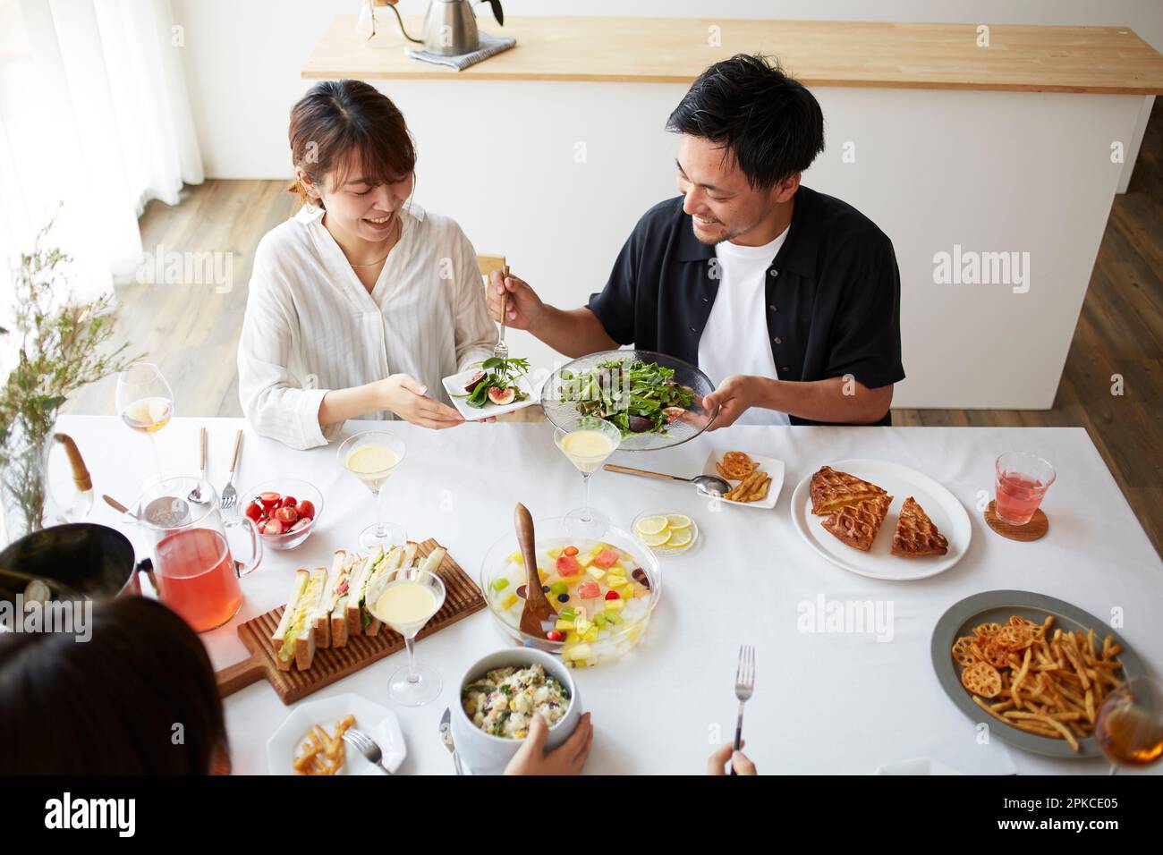 Groups of men and women who have home parties Stock Photo - Alamy