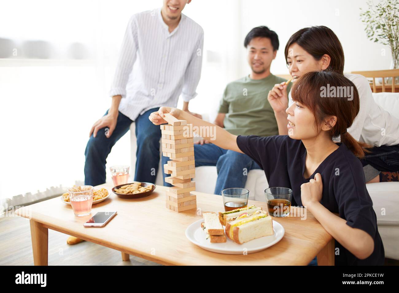 Men and women who play balance games Stock Photo - Alamy