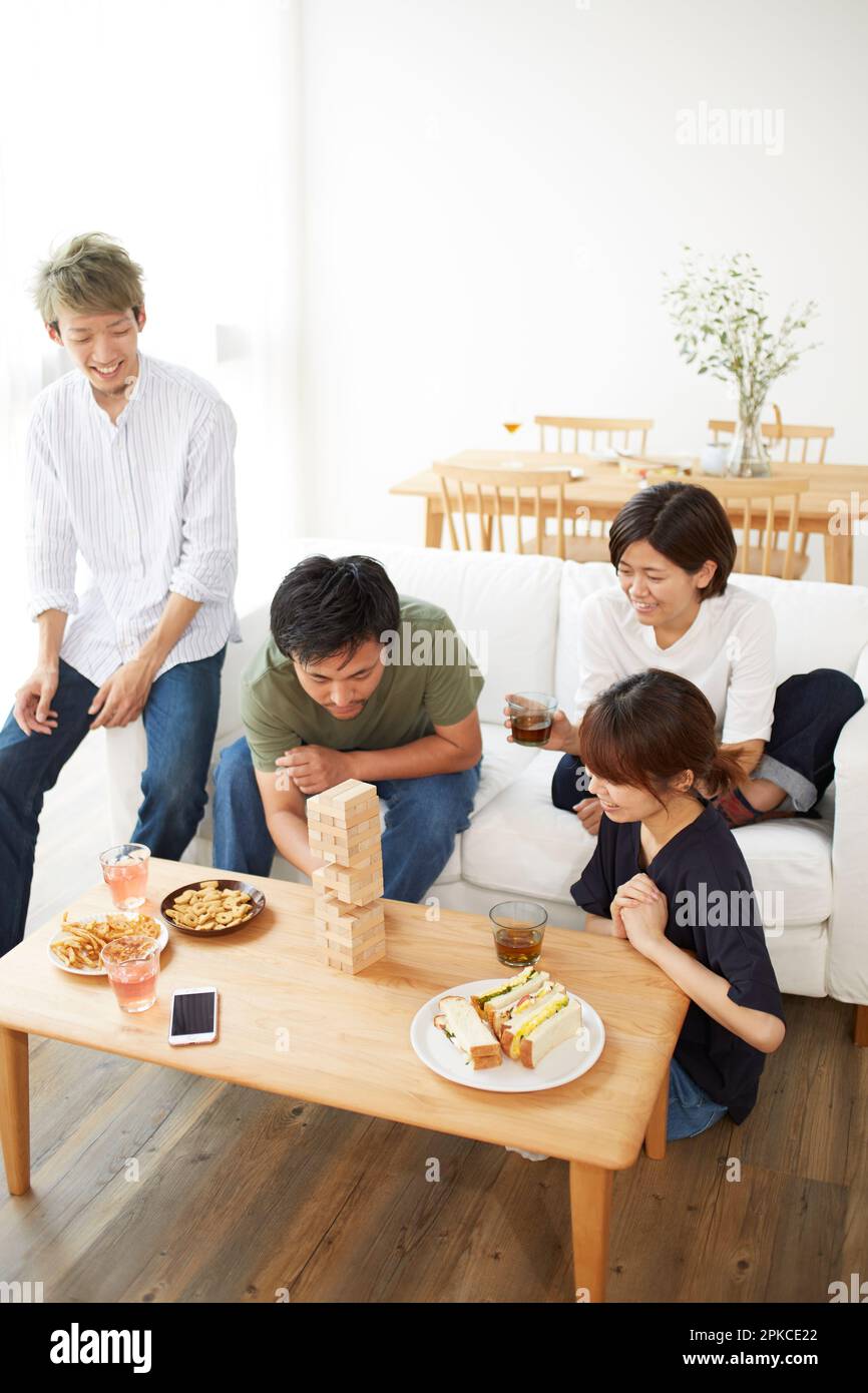 Men and women who play balance games Stock Photo - Alamy