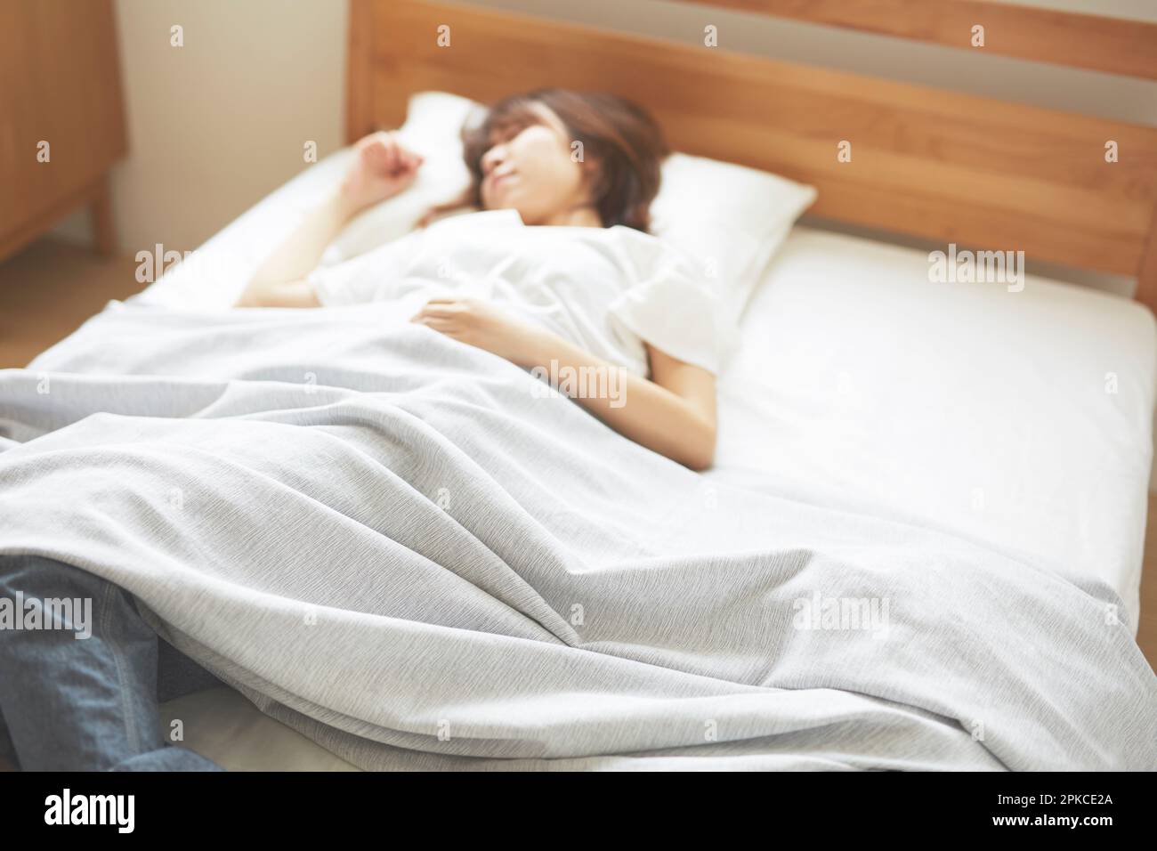 Woman sleeping in natural bed Stock Photo - Alamy