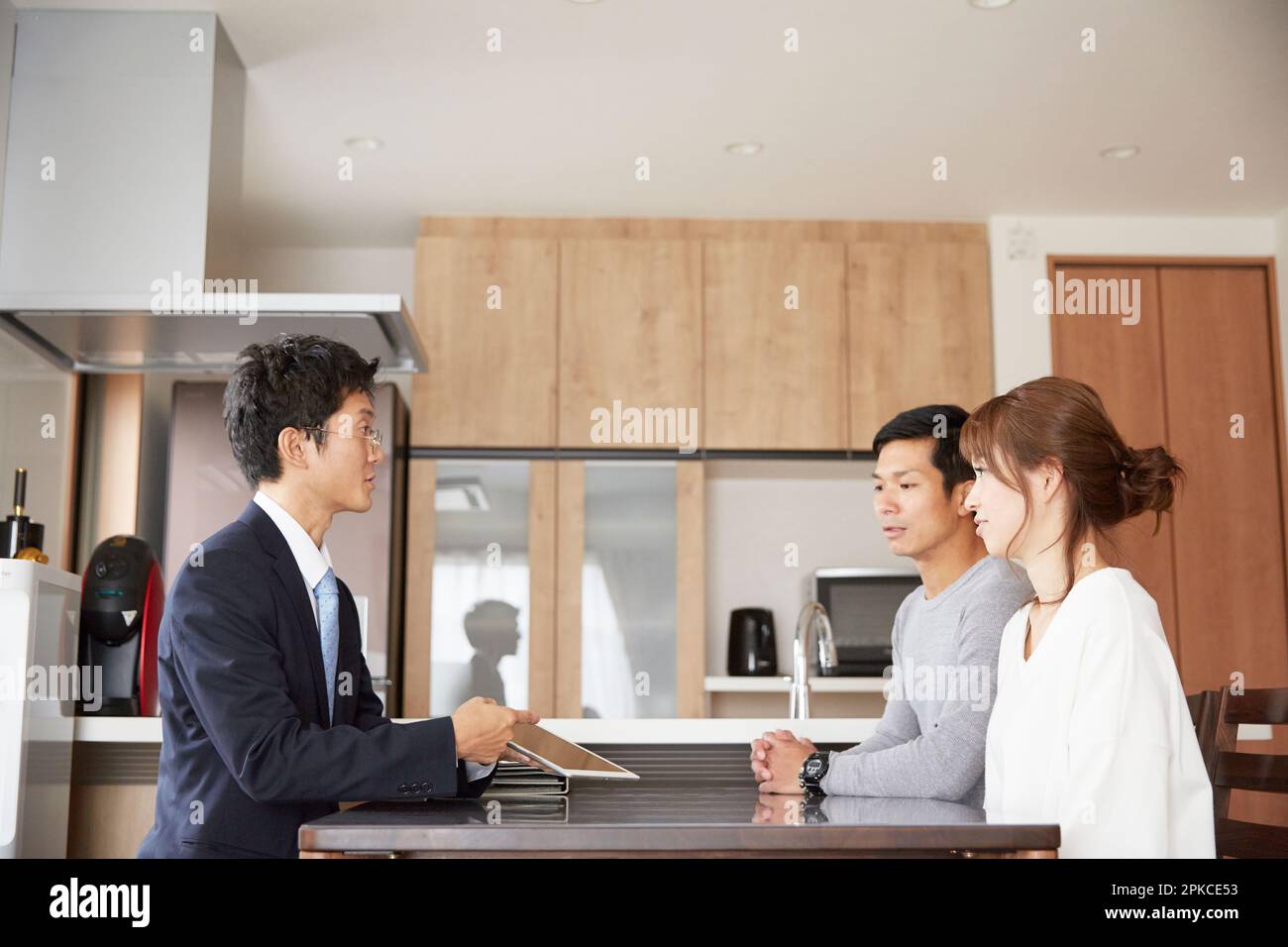 Asian man signing contract hi-res stock photography and images - Alamy