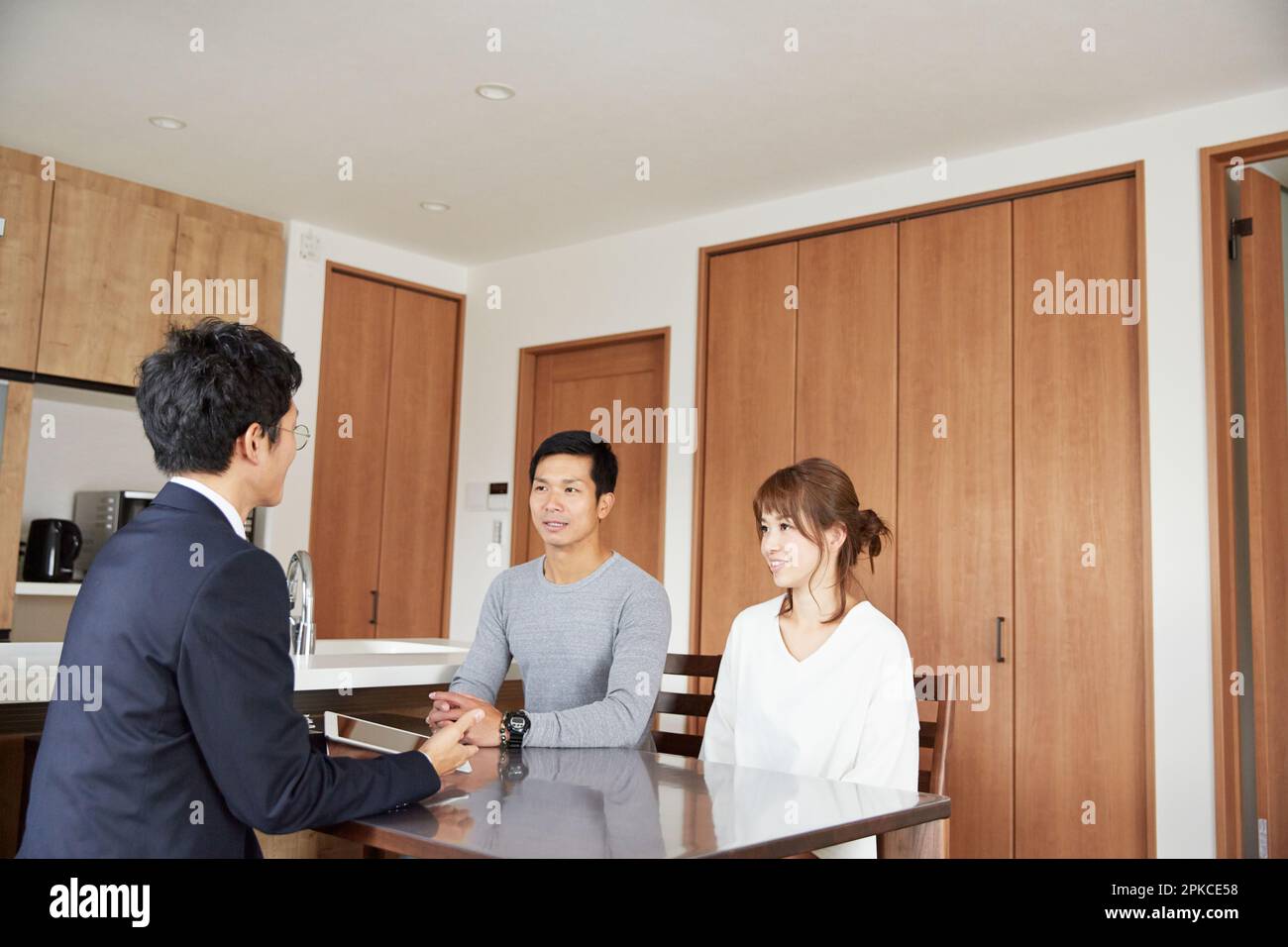 Asian man signing contract hi-res stock photography and images - Alamy