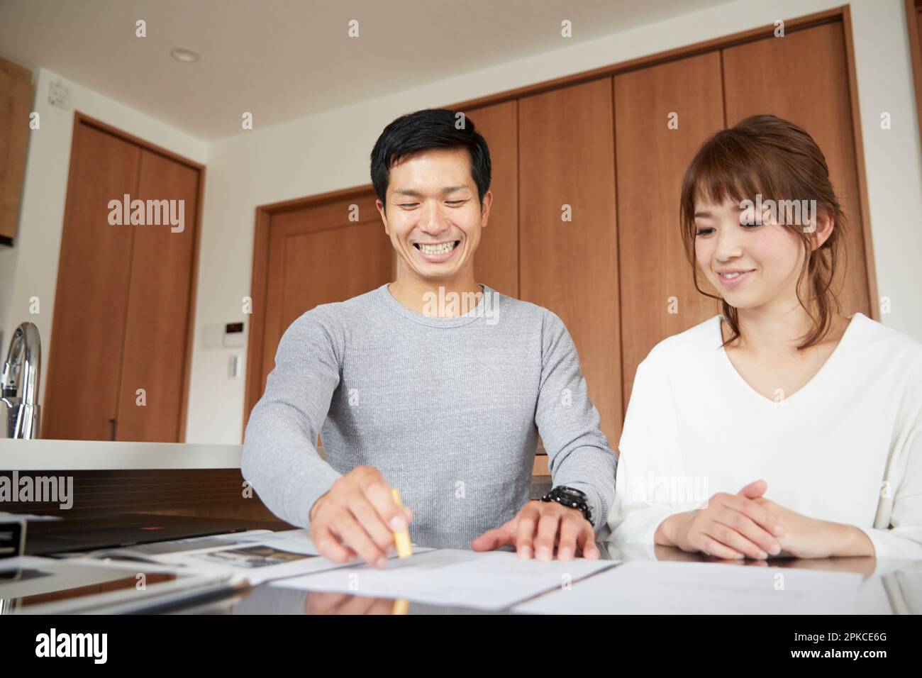 Couple new home woman documents hi-res stock photography and images - Alamy