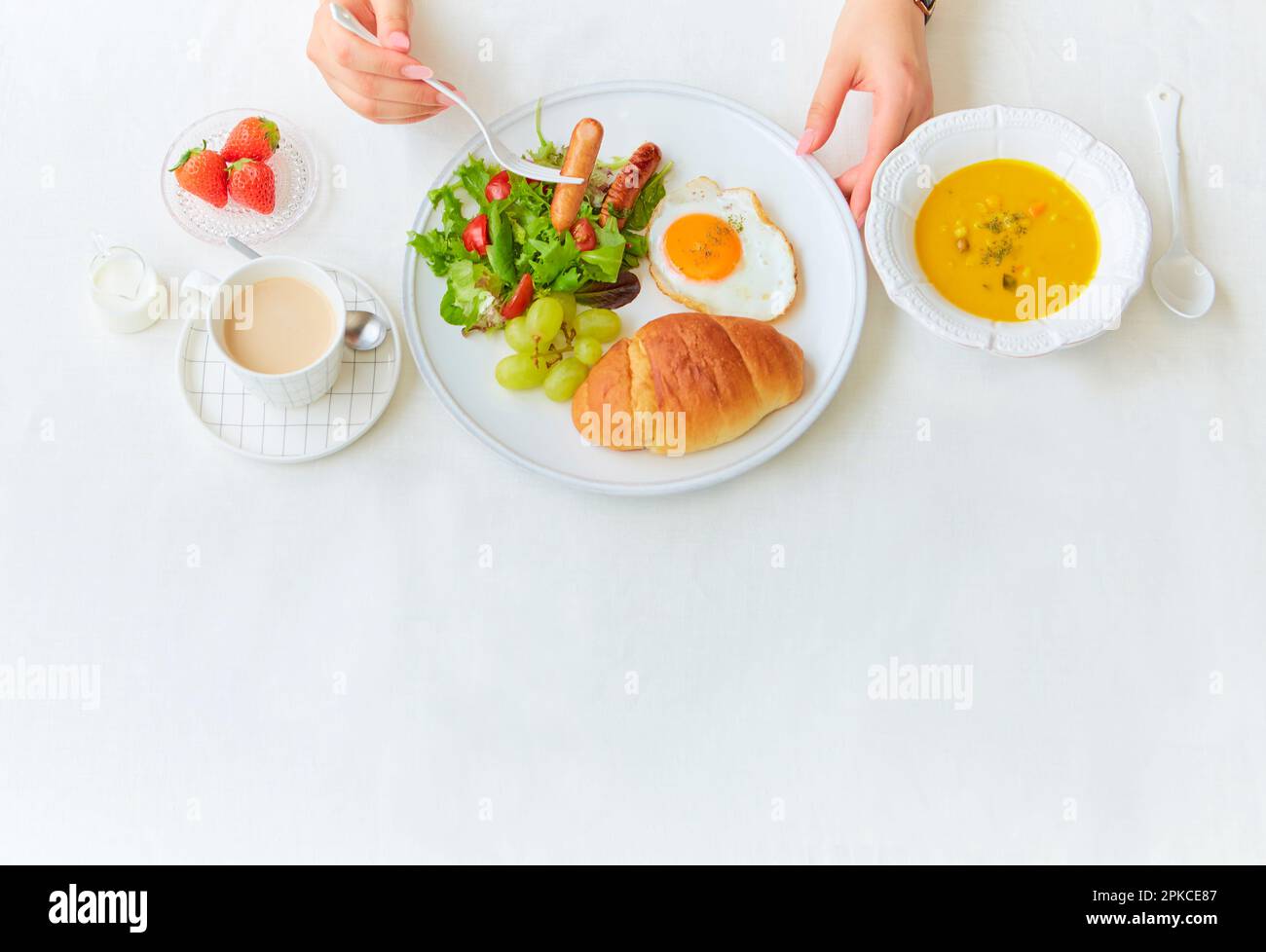 Breakfast set on white linen cloth Stock Photo - Alamy