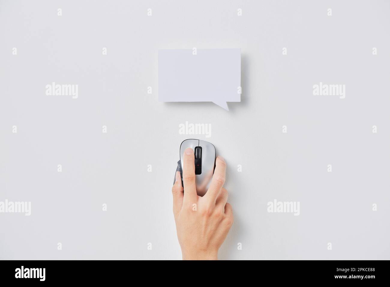 Computer mouse and square speech balloon Stock Photo - Alamy