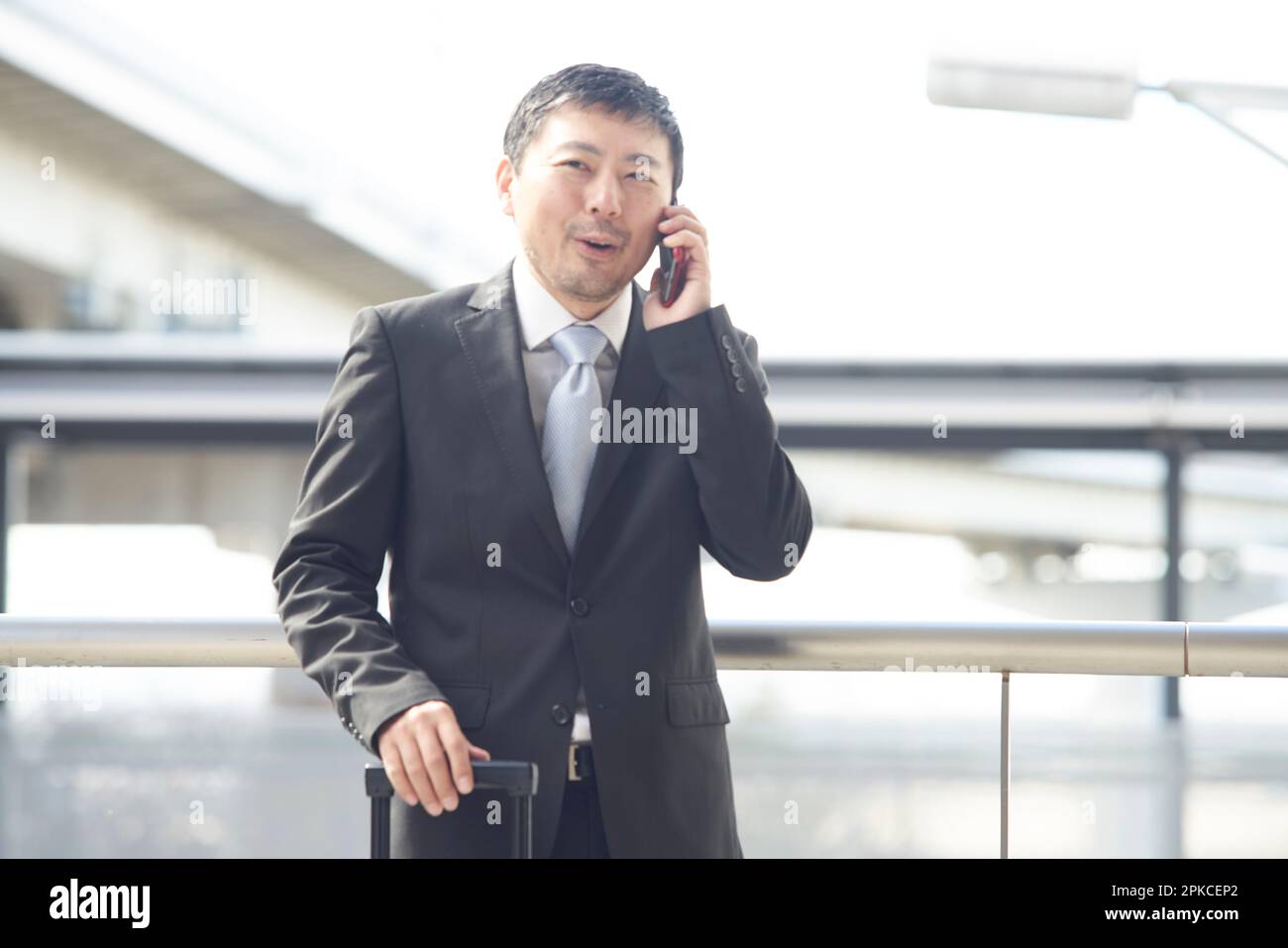 Office worker making a phone call Stock Photo - Alamy