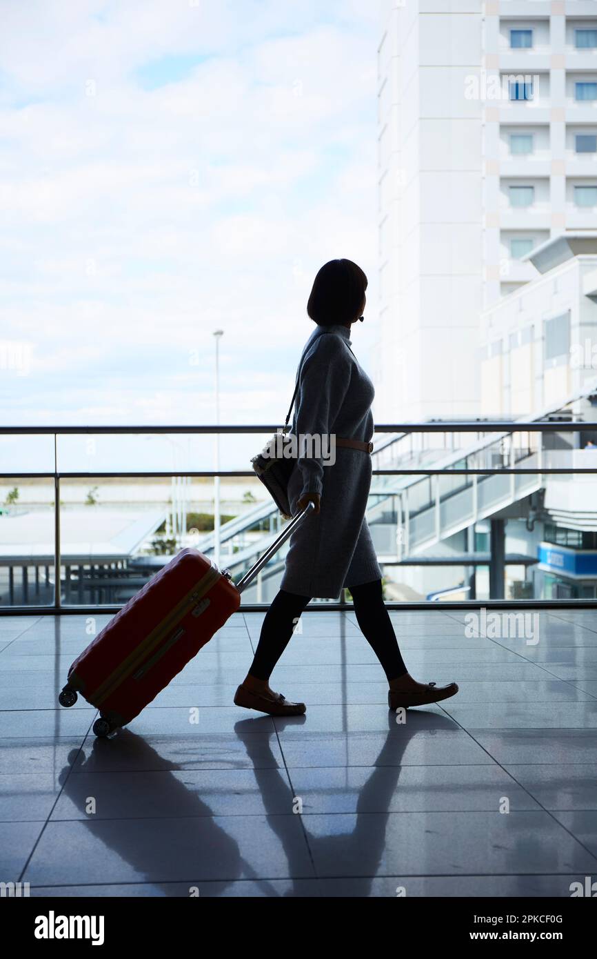 Two women walking down an airport aisle Stock Photo - Alamy Two women walking down an airport aisle Stock Photo - Alamy