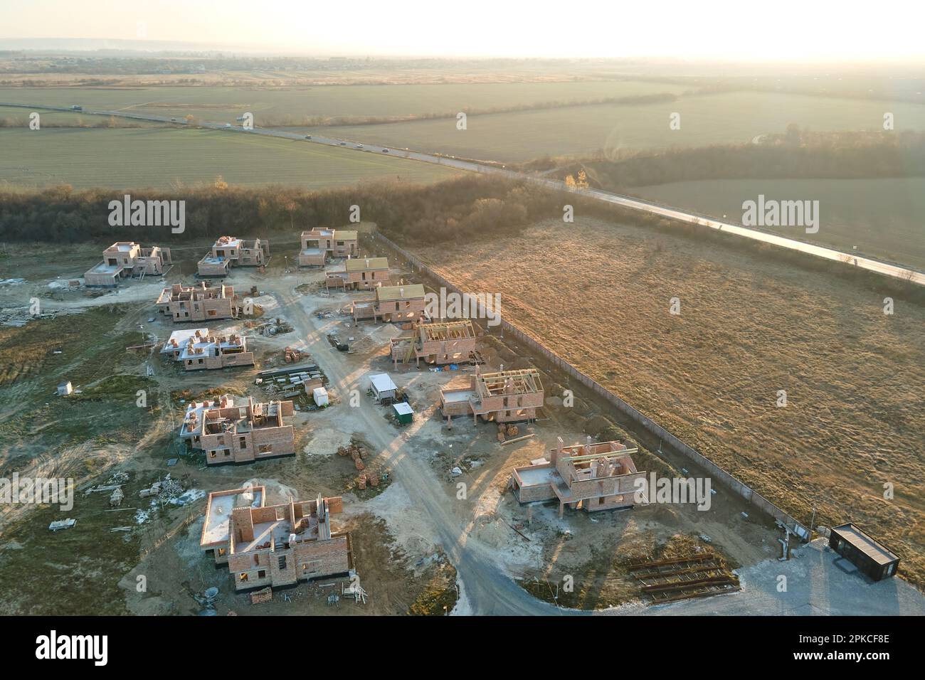 Industrial building site in rural area with residential houses under ...
