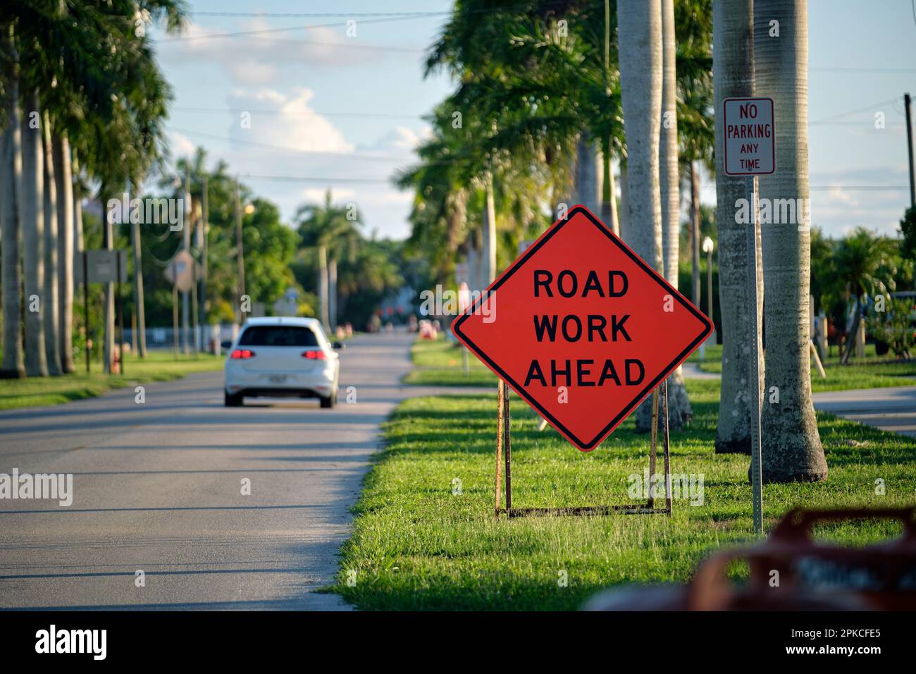 Road work ahead sign on street site as warning to cars about ...
