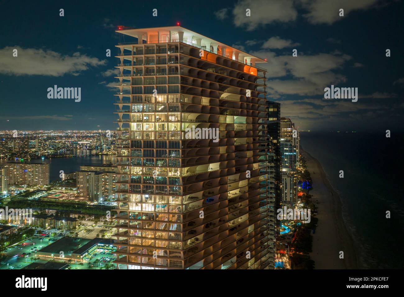 Residential high-rise skyscraper at night with view on Sunny Isles ...