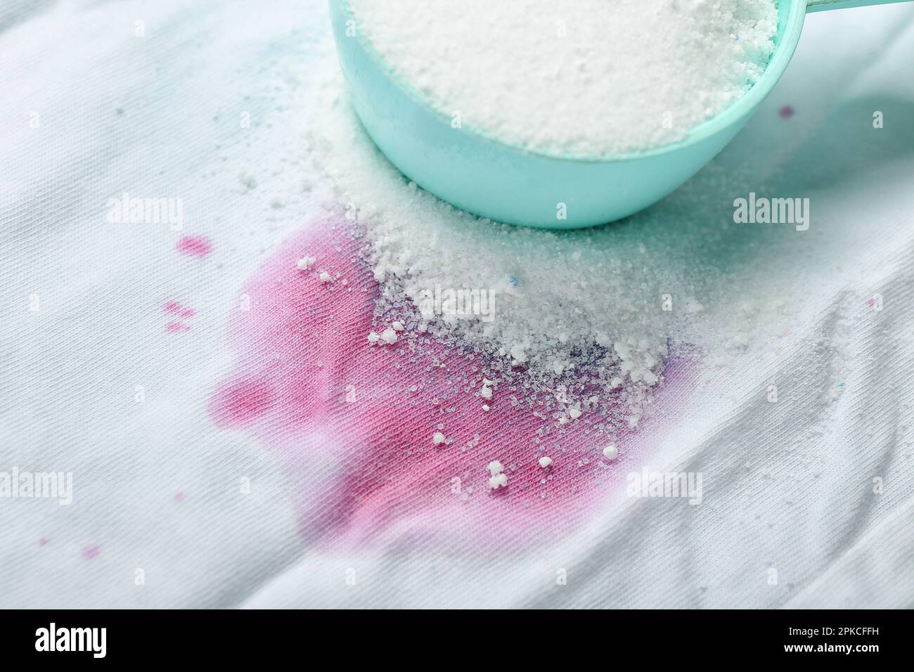 Laundry detergent on stained clothes, closeup Stock Photo - Alamy