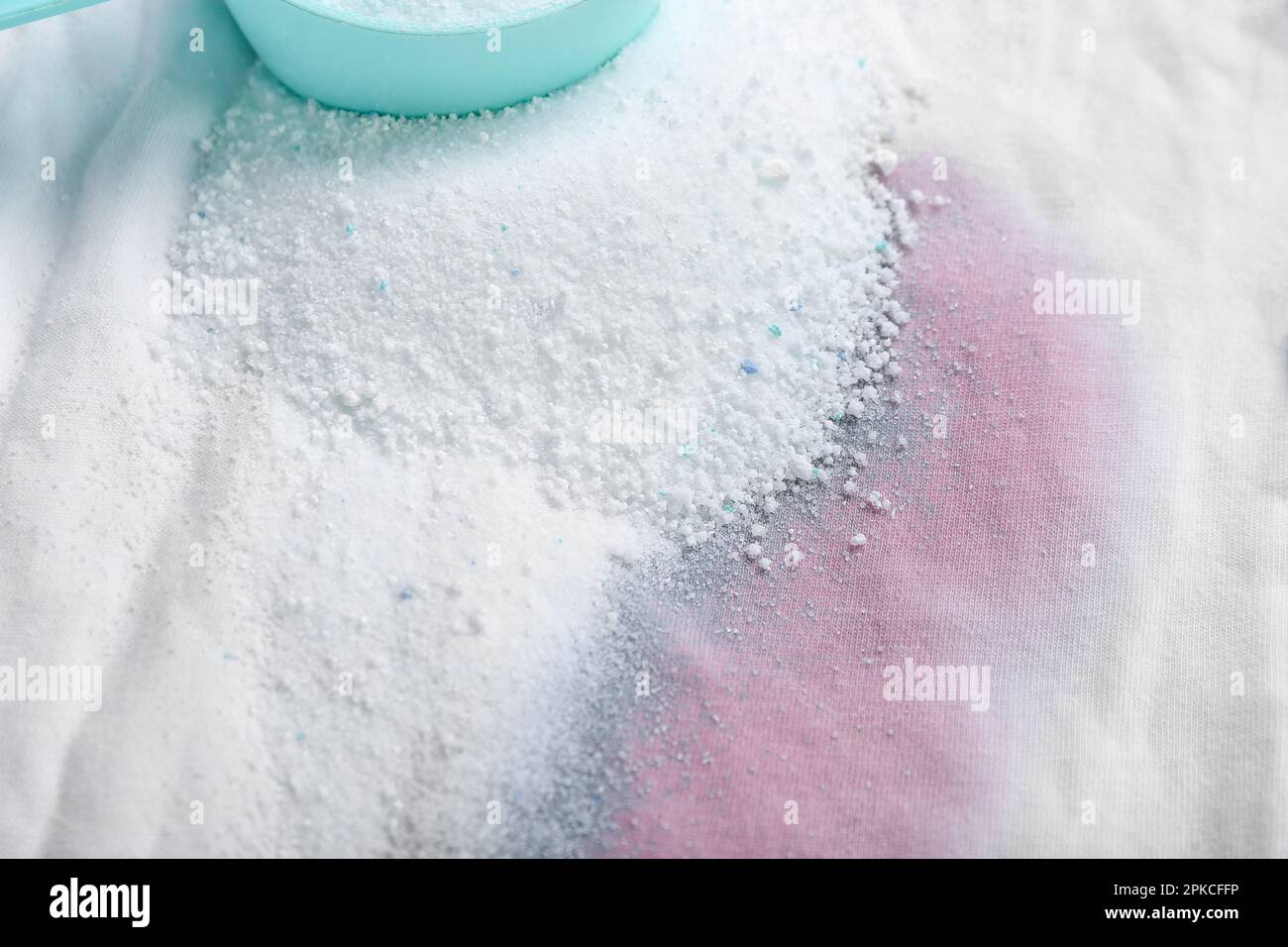Laundry detergent on stained clothes, closeup Stock Photo - Alamy
