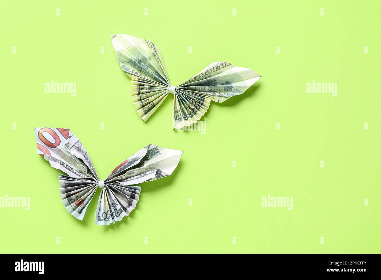 Origami butterflies made of dollar banknotes on green background Stock ...