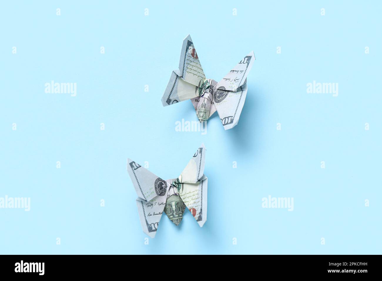 Origami butterflies made of dollar banknotes on blue background Stock ...