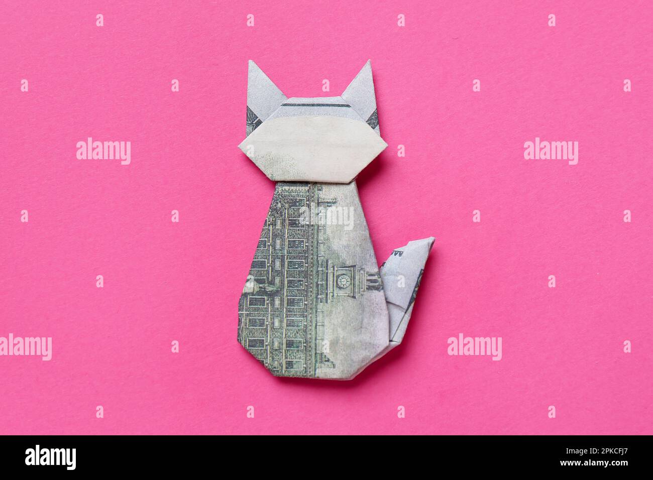 Origami cat made of dollar banknotes on pink background Stock Photo - Alamy