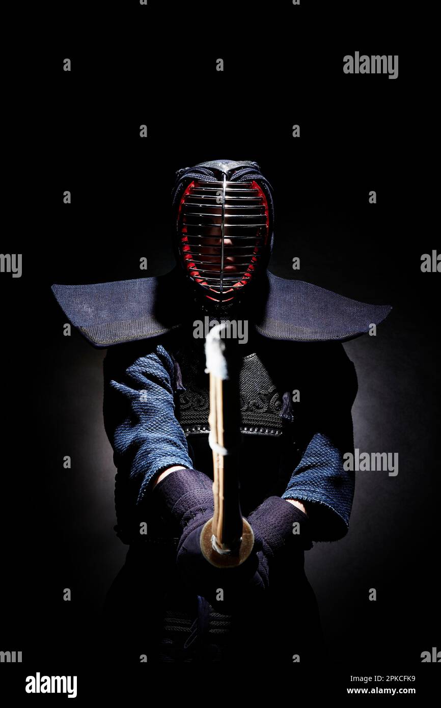 A man wearing a kendo gown in kendo stance Stock Photo - Alamy
