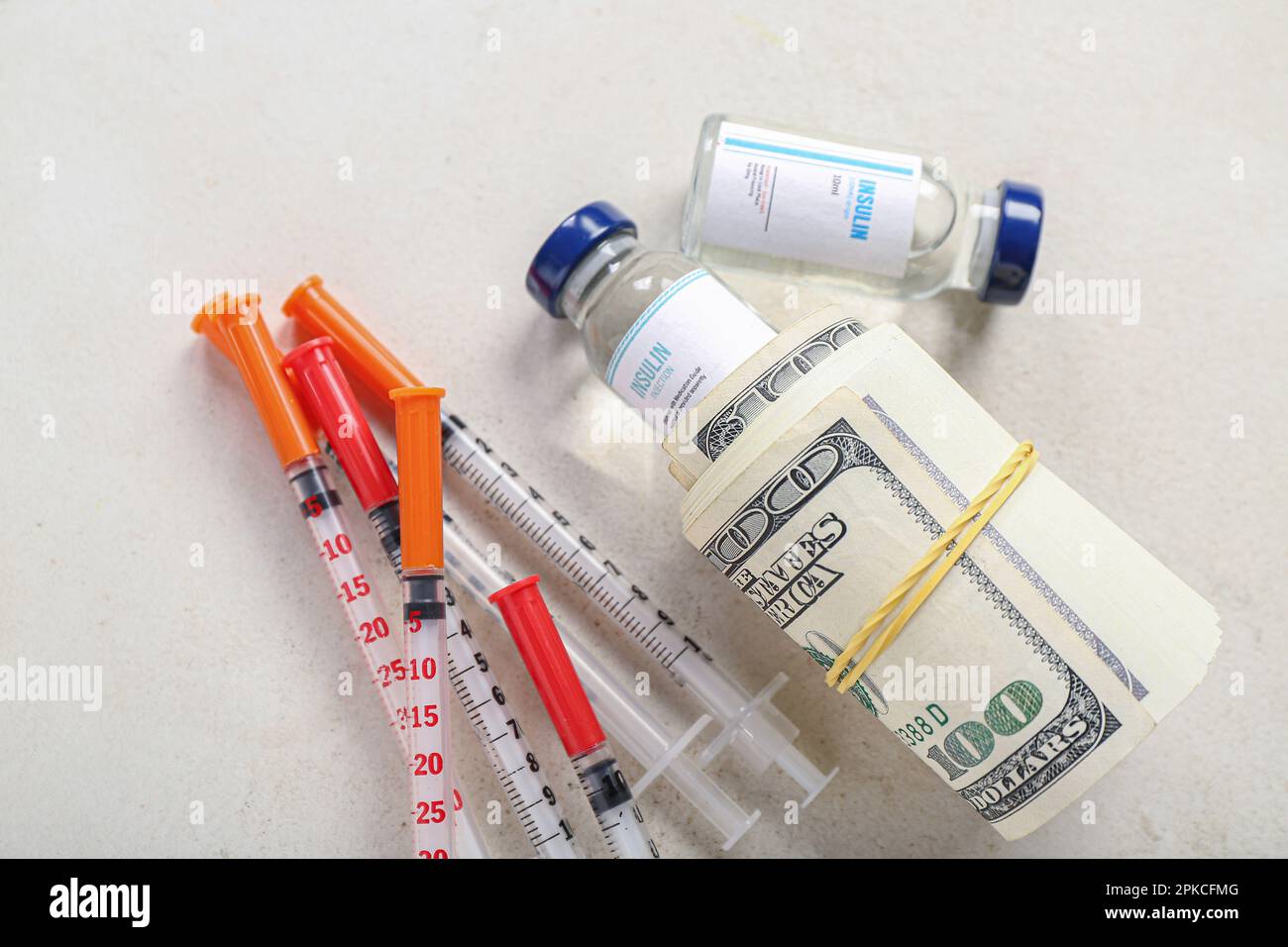 Insulin with syringes and money on white background. Expensive medicine ...
