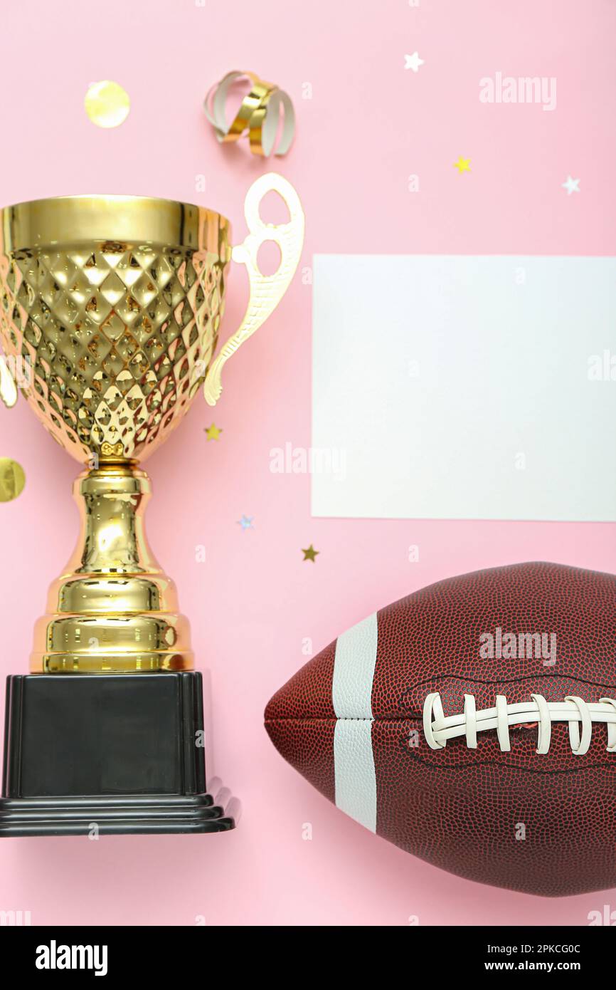 Blank card with gold cup, rugby ball and confetti on pink background ...