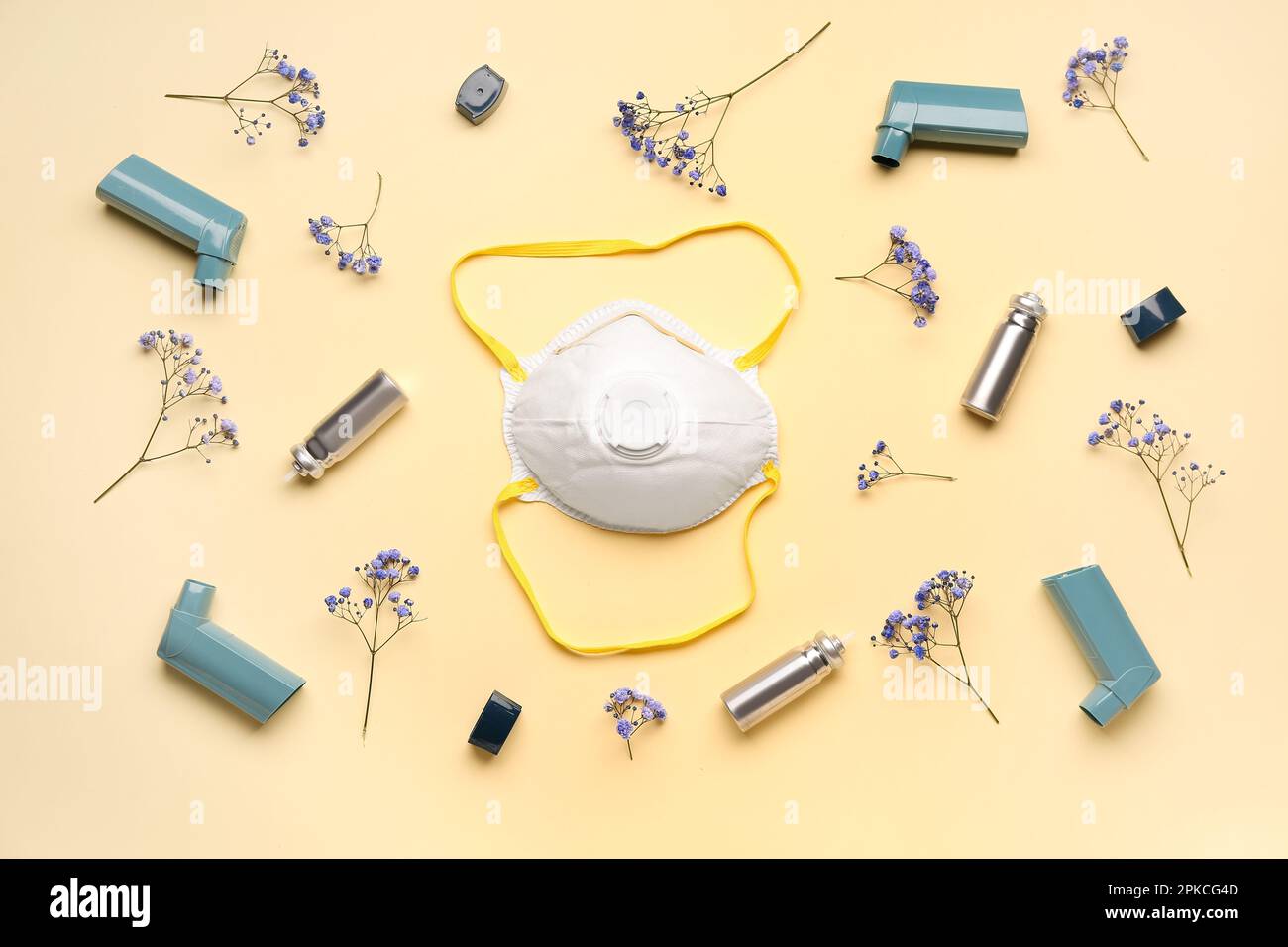 Asthma inhalers with mask and flowers on yellow background Stock Photo ...