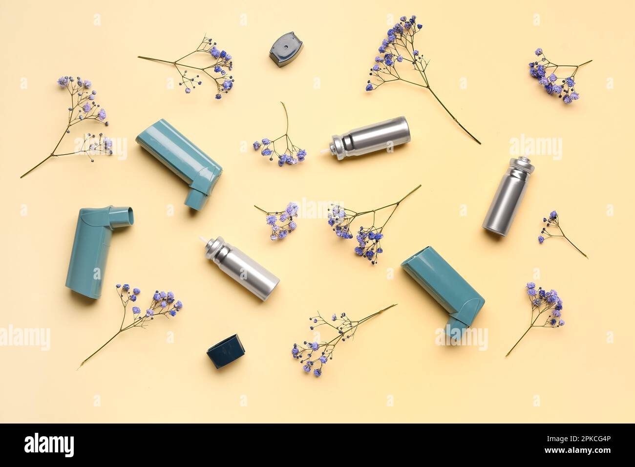 Asthma inhalers with flowers on yellow background Stock Photo - Alamy
