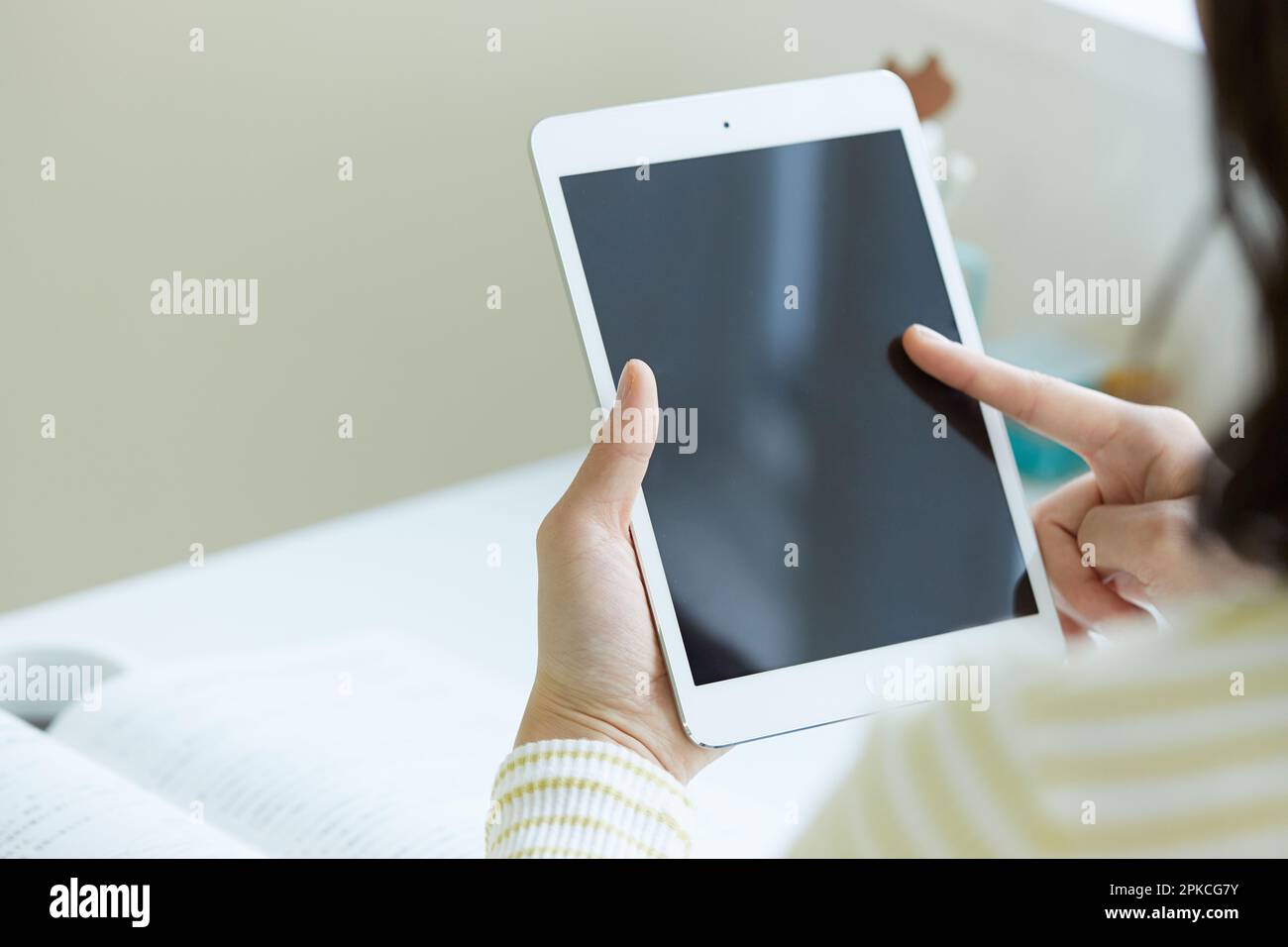 Female student studying using a tablet PC Stock Photo - Alamy