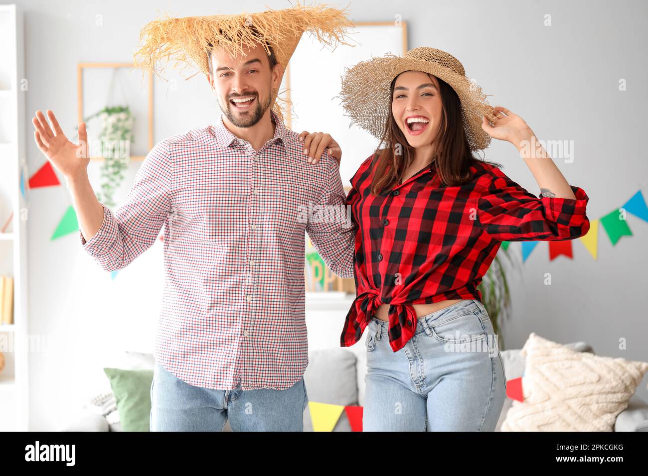 Young couple celebrating Festa Junina (June Festival) at home Stock ...