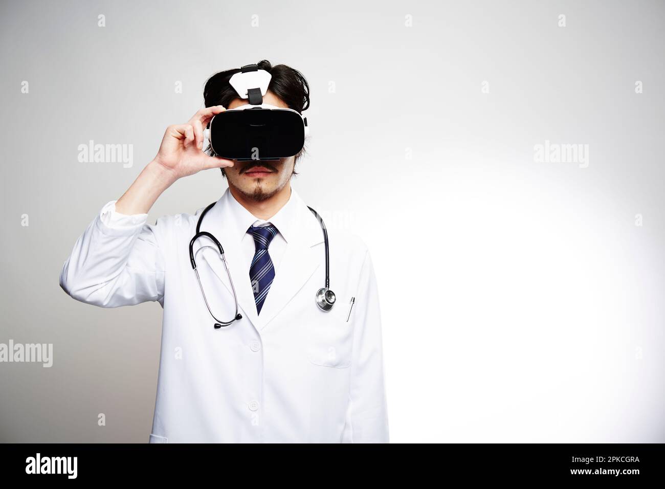 Male doctor wearing VR goggles Stock Photo - Alamy