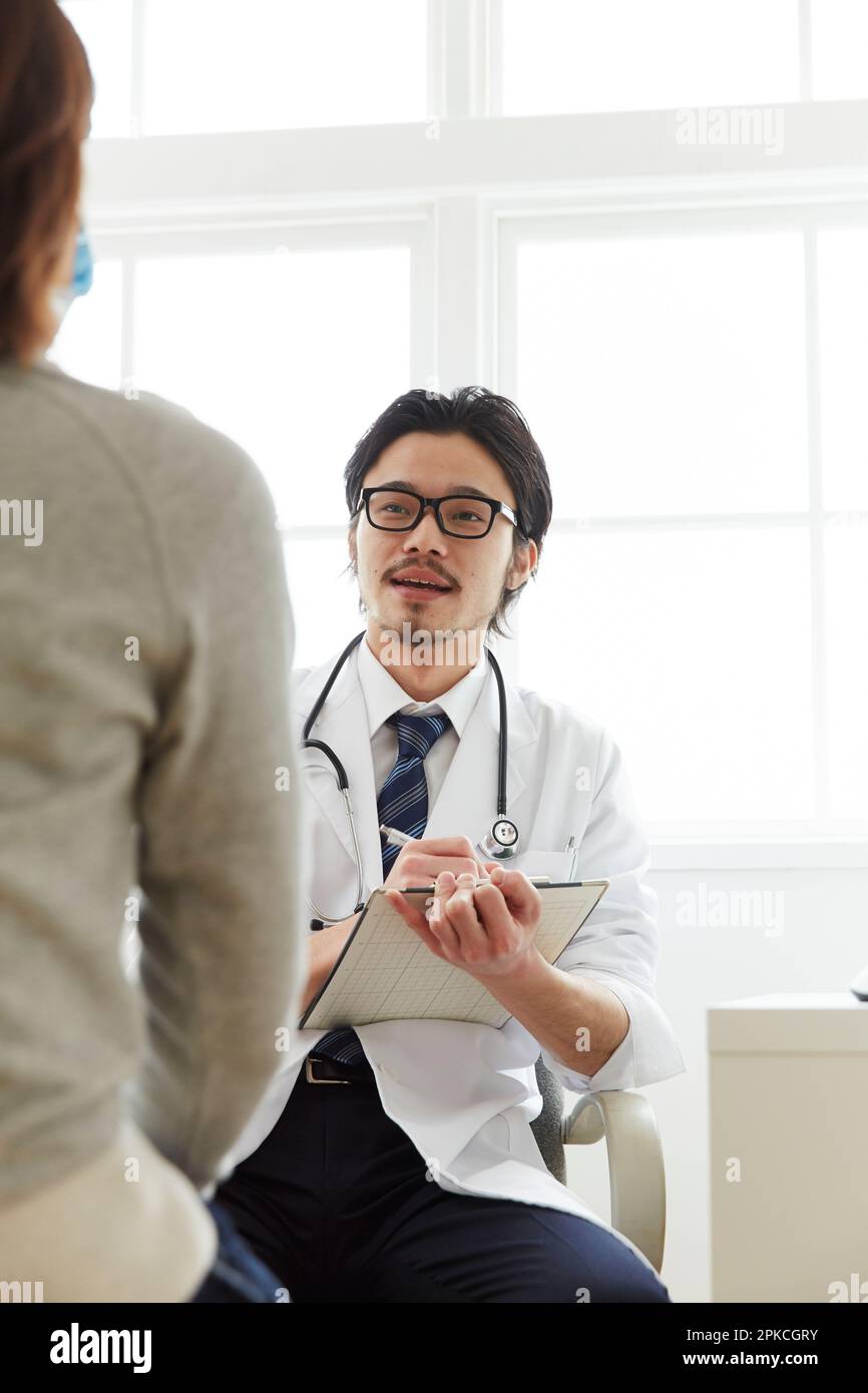 Male doctor making a medical interview Stock Photo - Alamy