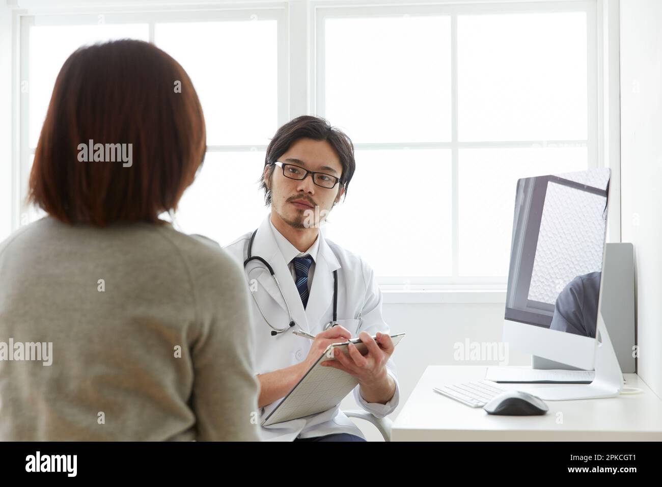 Male doctor making a medical interview Stock Photo - Alamy