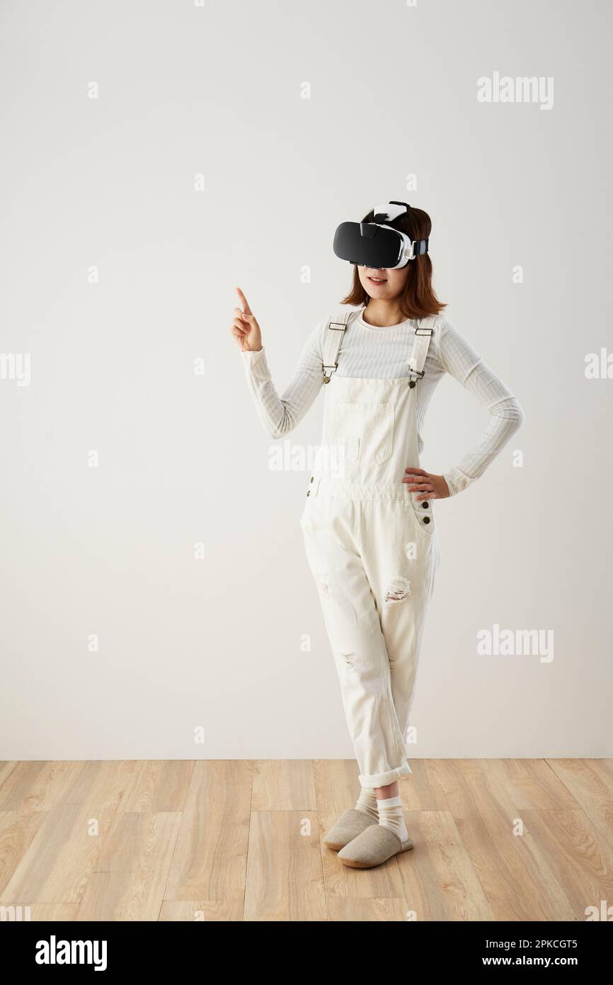 Pointing woman wearing vr hi-res stock photography and images - Alamy