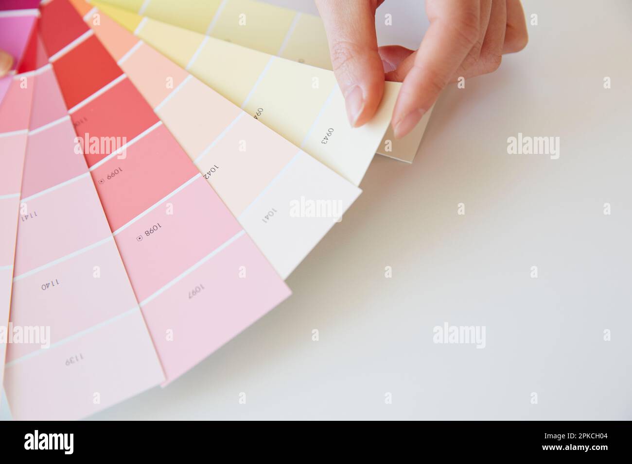 Woman's hand with color chips spread in a fan shape Stock Photo - Alamy